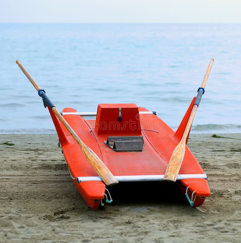 Red Rescue Boat with Wooden Oars Stock Image - Image of emergency, boat ...