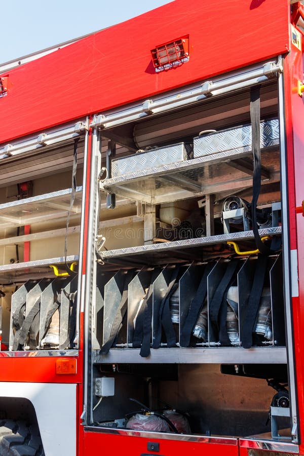 Rescue Fire Truck Equipment. Compartment of Rolled Up Fire Hoses on a ...