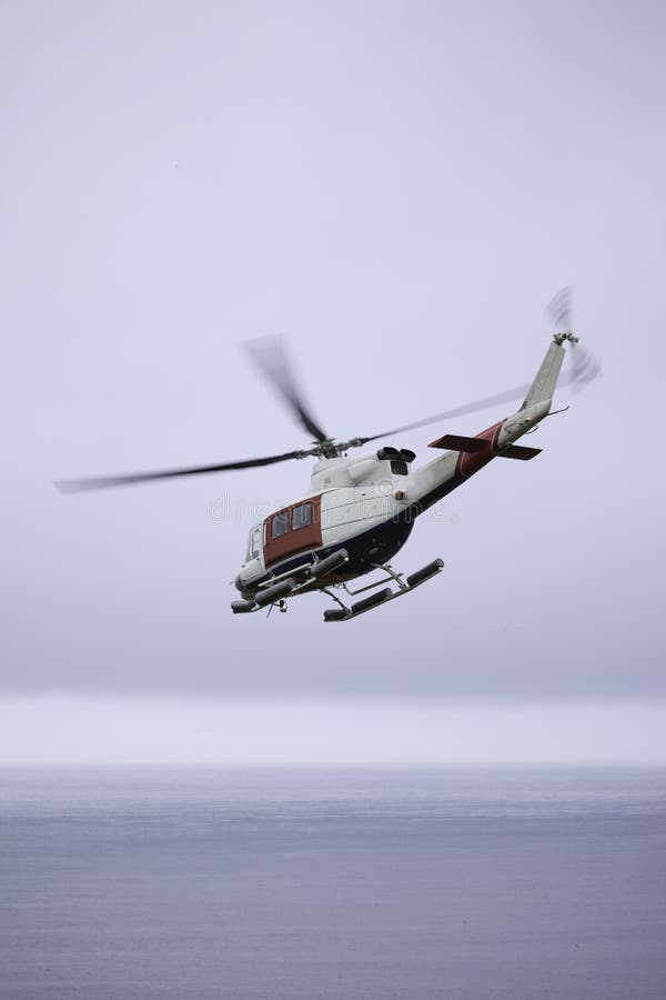 Rescue Helicopter Flying Over the Ocean Stock Image - Image of urgency ...