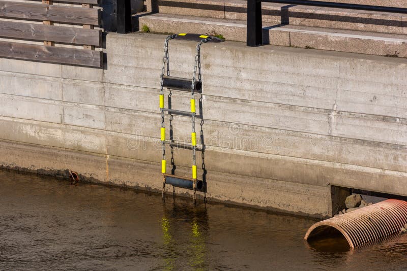 Rescue ladder by a river.. stock image. Image of firefighter - 258741547
