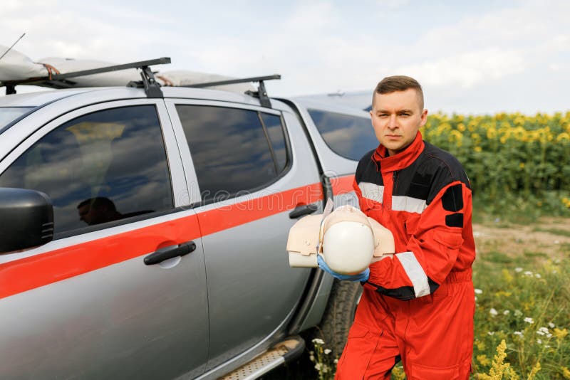 Rescue Team. the Man Shows the Provision of First Aid in the ...