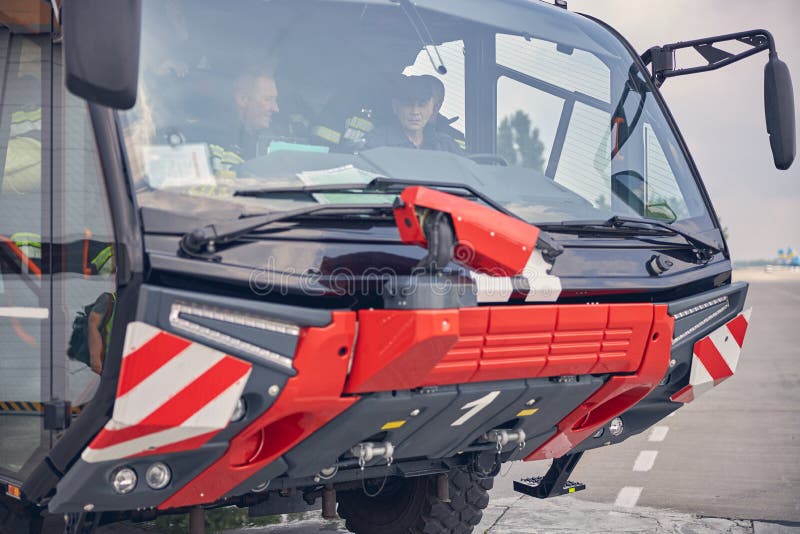Rescue Team Sitting in the Red Fire Engine Stock Image - Image of ...