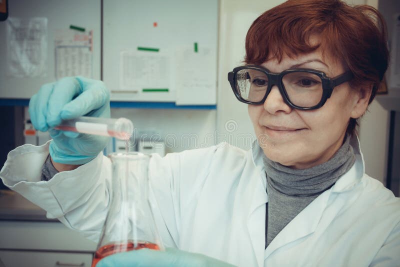 Research Assistant Works with Red Liquid in Laboratory Stock Photo ...