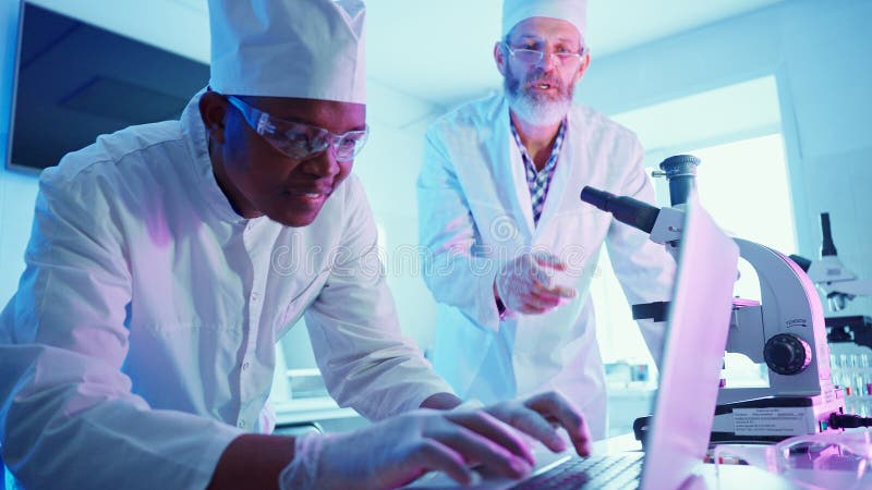 Research Chemists Analyzing Data in Innovative Laboratory with Advanced ...