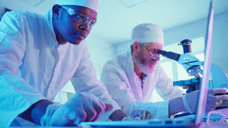 Research Chemists Analyzing Data in Innovative Laboratory with Advanced Equipment Stock Photo ...