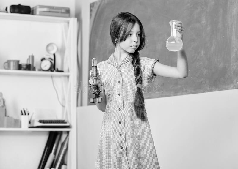 Research and Development. Girl Study Chemistry with Testing Tube ...