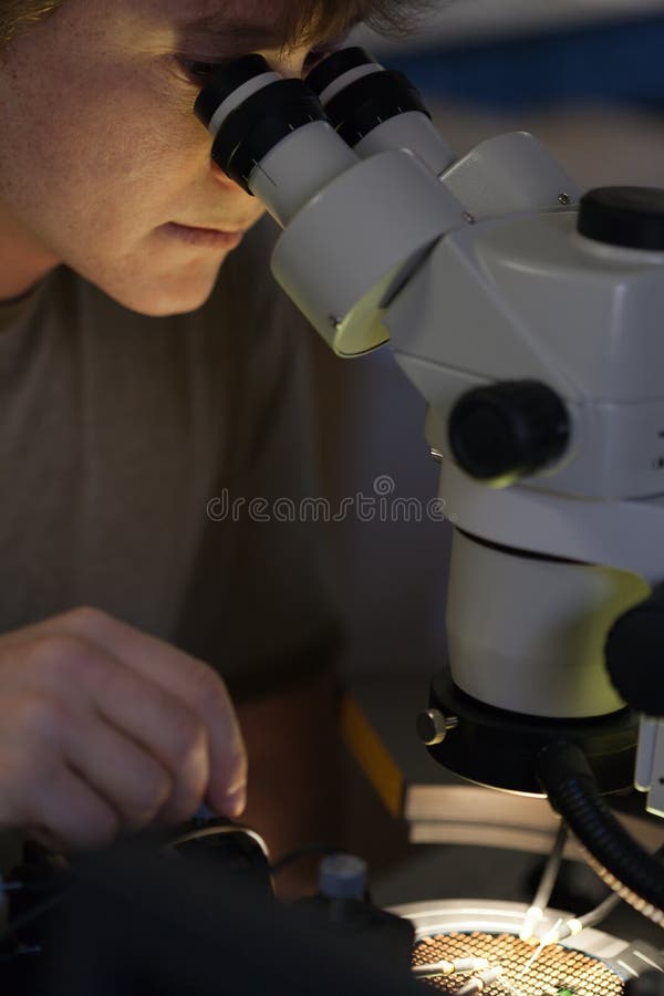 Research Scientist Looking at Microchip with Scope Stock Image - Image ...