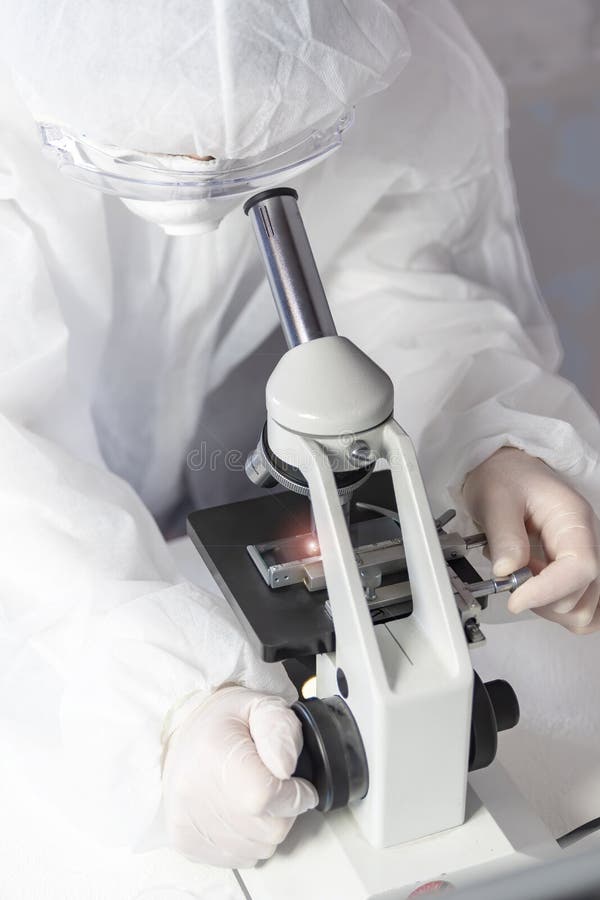 Research Scientist Using a Microscope in a Laboratory. Stock Photo ...