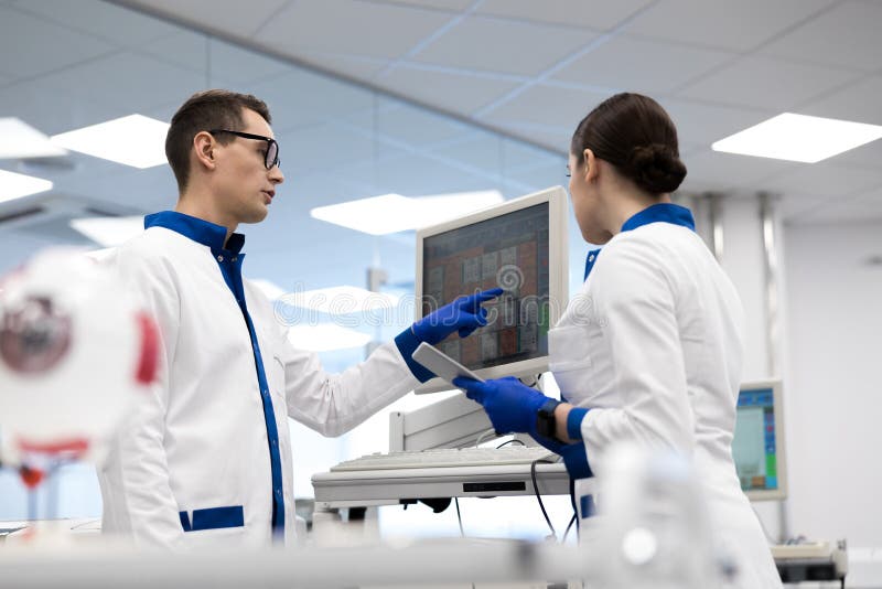 Research Scientists Working with Modern Equipment in Laboratory Stock ...
