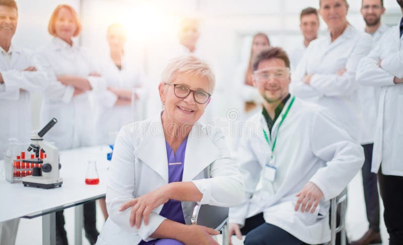 Research Supervisor and a Group of Young Scientists in the Workplace ...