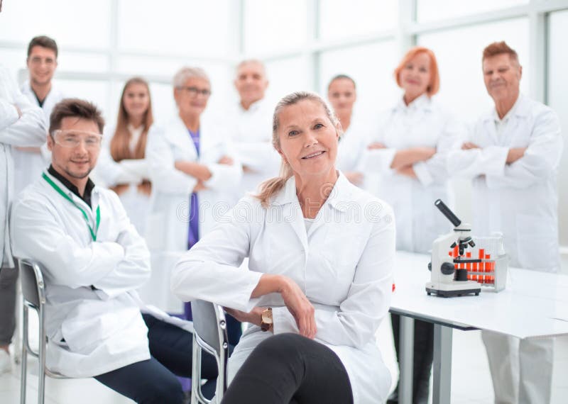 Research Supervisor and a Group of Young Scientists in the Workplace ...