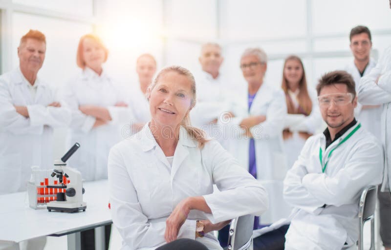 Research Supervisor and a Group of Young Scientists in the Workplace ...