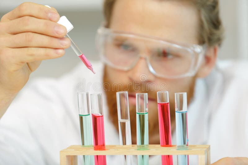 Research Worker Doing Experiments with Chemical Liquid at Laboratory ...