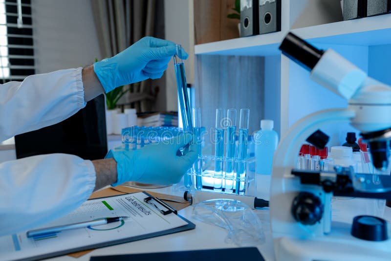 A Researcher is Conducting Scientific Experiments on a Liquid Substance ...