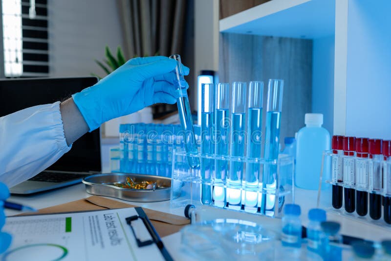 A Researcher is Conducting Scientific Experiments on a Liquid Substance ...