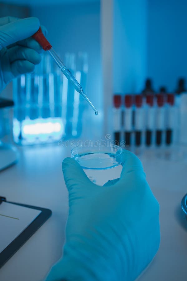 A Researcher is Conducting Scientific Experiments on a Liquid Substance ...