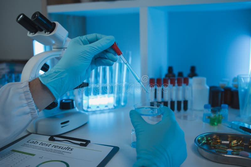 A Researcher is Conducting Scientific Experiments on a Liquid Substance ...