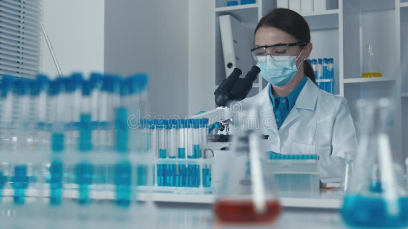 A Researcher Deeply Immersed in the Study of the Microscopic World ...