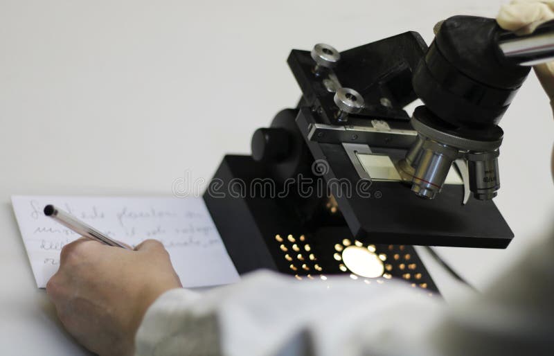 A Researcher Doing a Microscope Analysis. Stock Image - Image of ...