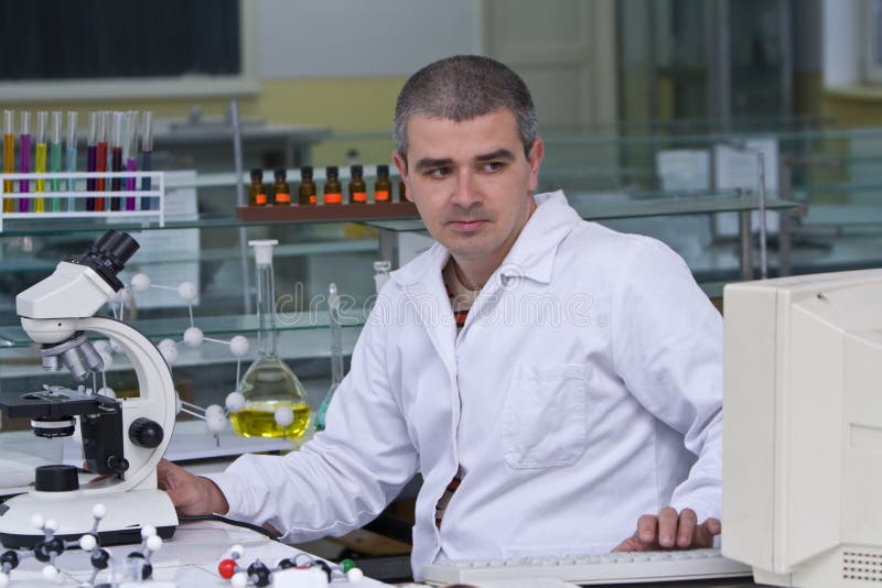 Researcher Checking His Mobile Stock Photo - Image of keyboard, optics ...