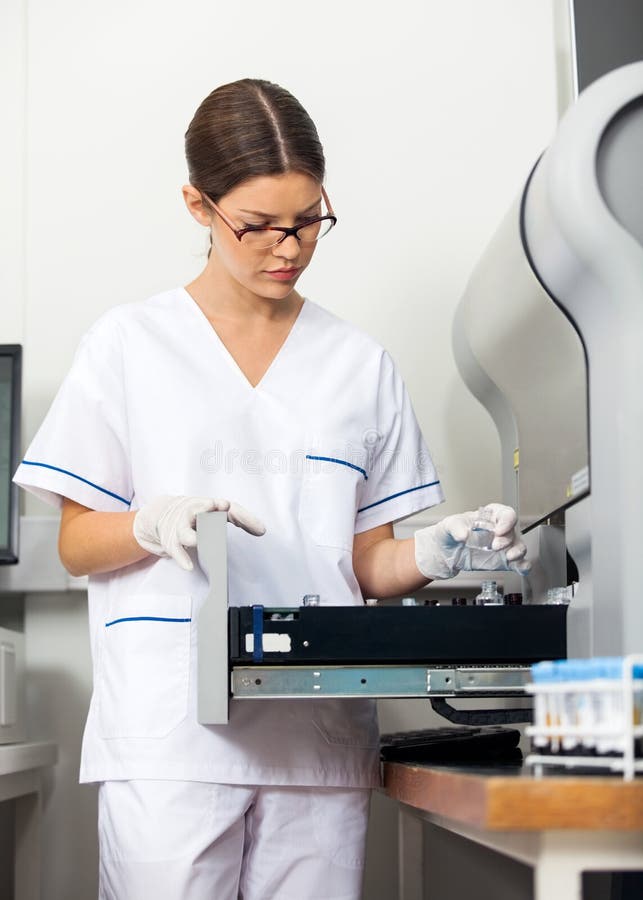 Researcher Loading Samples into Analyzer in Lab Stock Photo - Image of ...