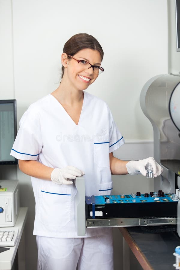 Researcher Loading Solutions into Analyzer Stock Image - Image of ...