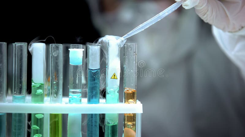 Researcher Pouring Chemicals into a Test Tube Stock Image - Image of ... Researcher Pouring Chemicals into a Test Tube Stock Image - Image of ...