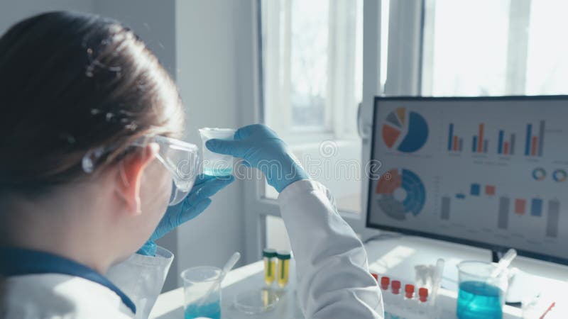 A Dedicated Laboratory Researcher is Meticulously Analyzing Complex ...