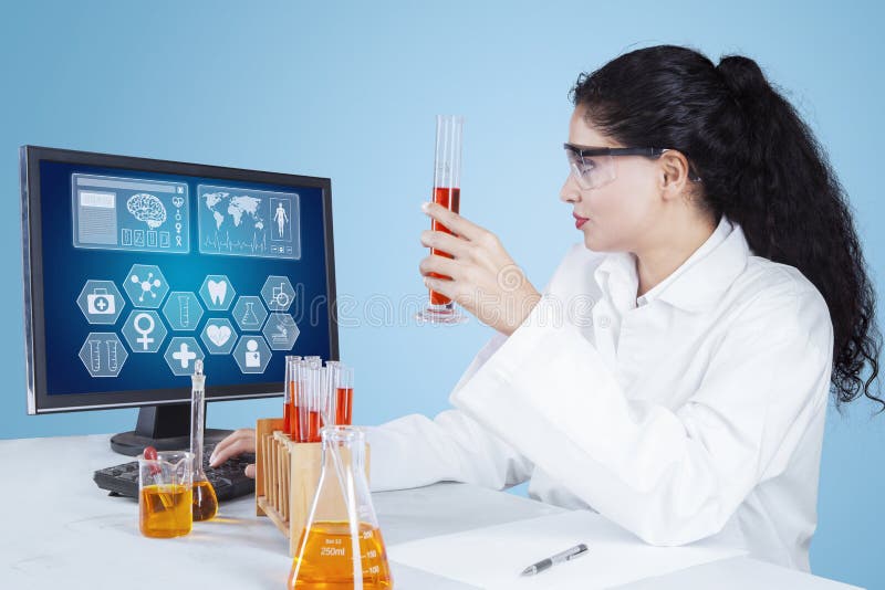 Researcher Using Computer while Making Experiment Stock Photo - Image ...