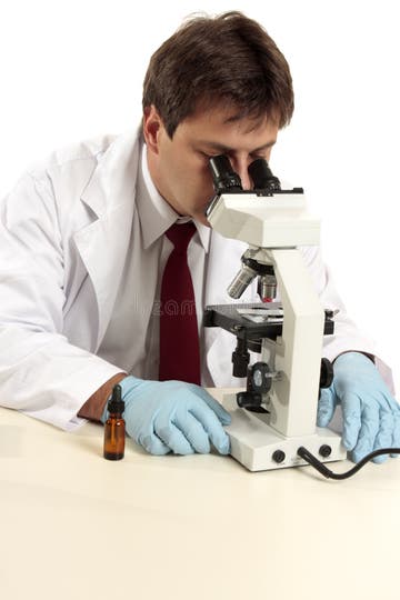 Researcher Viewing Substance Under Microscope Stock Image - Image of ...