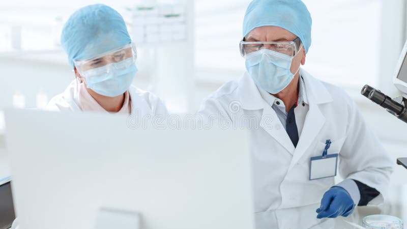 Researchers Discuss Data from a Computer Monitor. Stock Image - Image ...