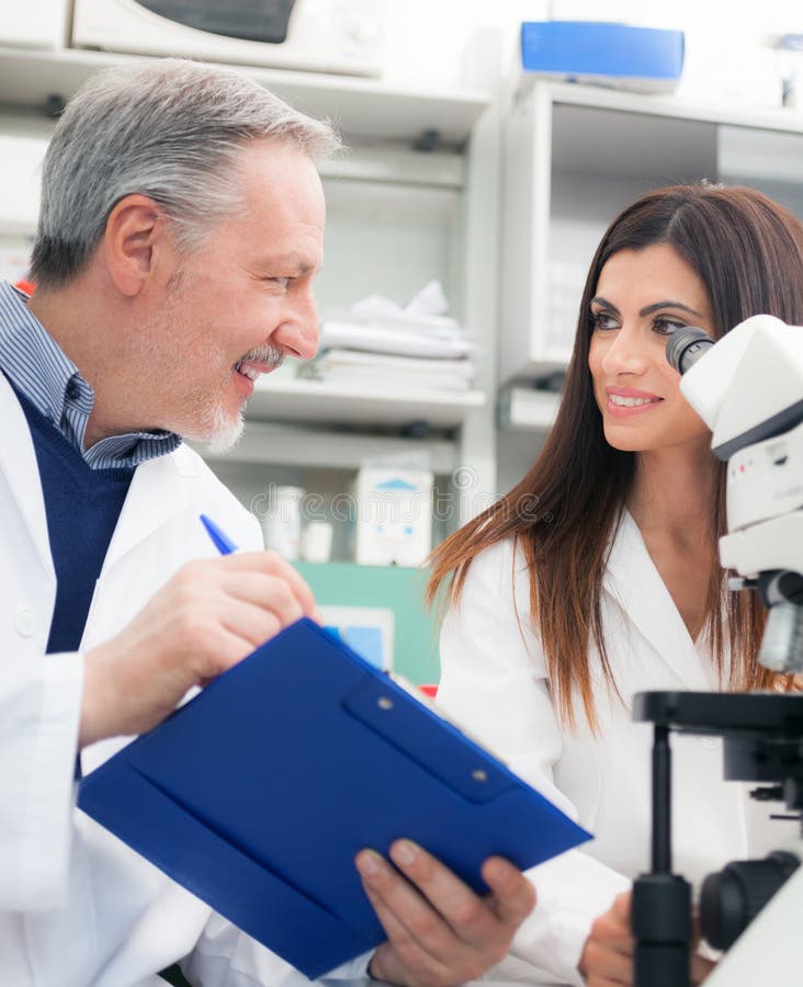 Researchers at work stock image. Image of biotechnology - 41801619