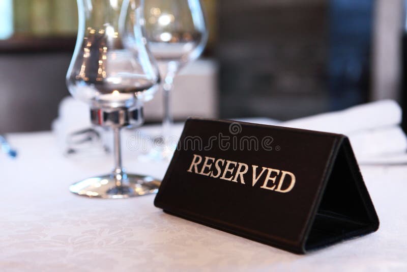 Reserve Table in the Restaurant. There is a Sign on the Table with the ...