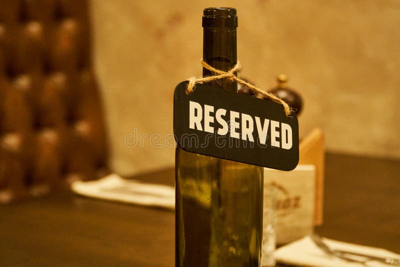 Reserved. a Label on the Bottle. Reserved Table in the Restaurant. the ...