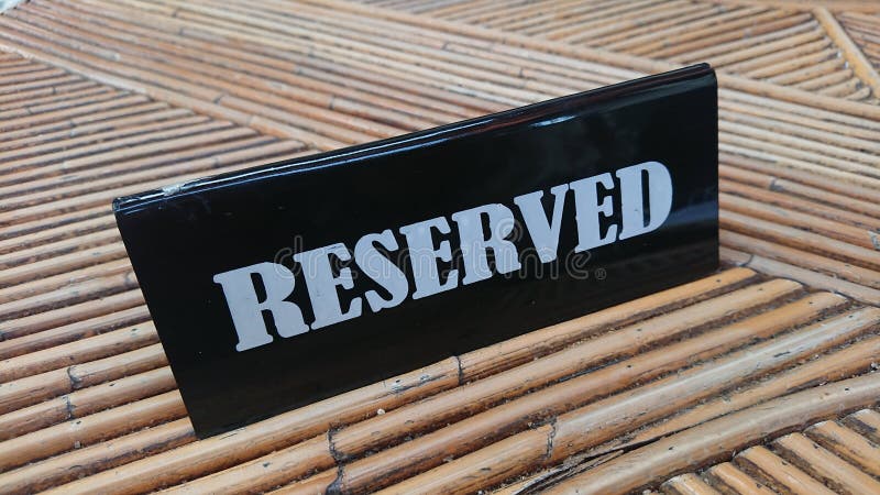 Reserved Sign, Black Acrylic at Bamboo Table Stock Image - Image of ...