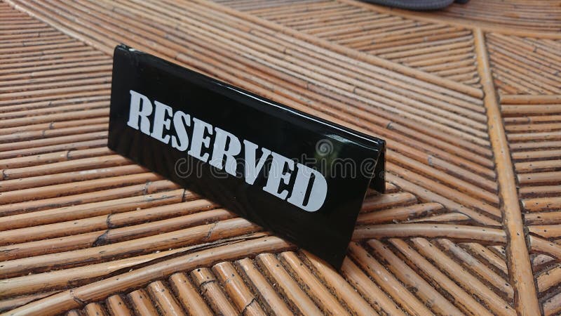Reserved Sign, Black Acrylic at Bamboo Table Stock Image - Image of ...