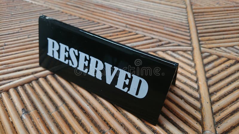 Reserved Sign, Black Acrylic at Bamboo Table Stock Image - Image of ...