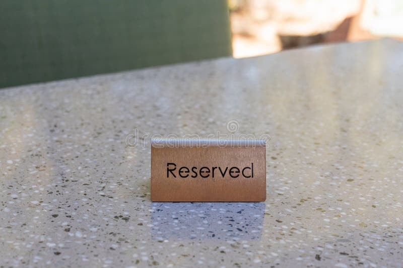 Reserved Sign on an Outdoor Dining Table Stock Image - Image of mottled ...
