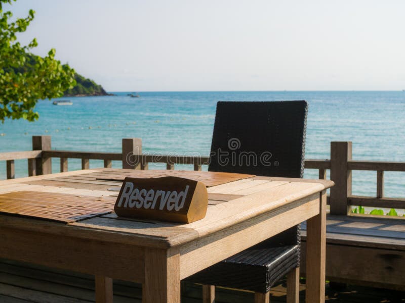 Reserved Sign on Restaurant Table Beach View Stock Image - Image of ...