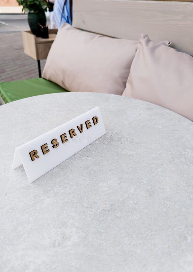 Reserved sign on a table stock photo. Image of enjoyment - 334117186