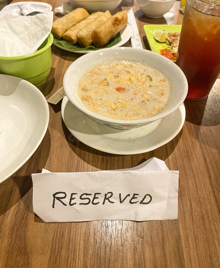 Reserved Sign on Table in Restaurant with Served Food Stock Photo ...