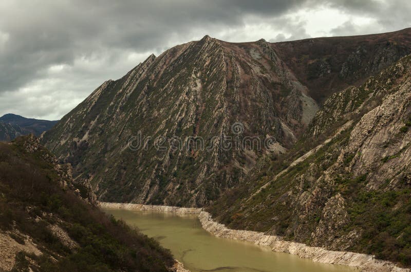 Reservoir in the Bed of a River between Mountains Stock Photo - Image ...