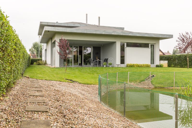 Residence with a backyard stock photo. Image of pond - 100211280