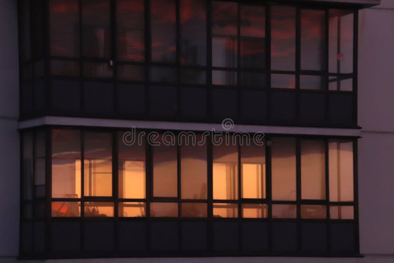 Residential Building Balcony with Orange Sky Reflection Stock Image ...