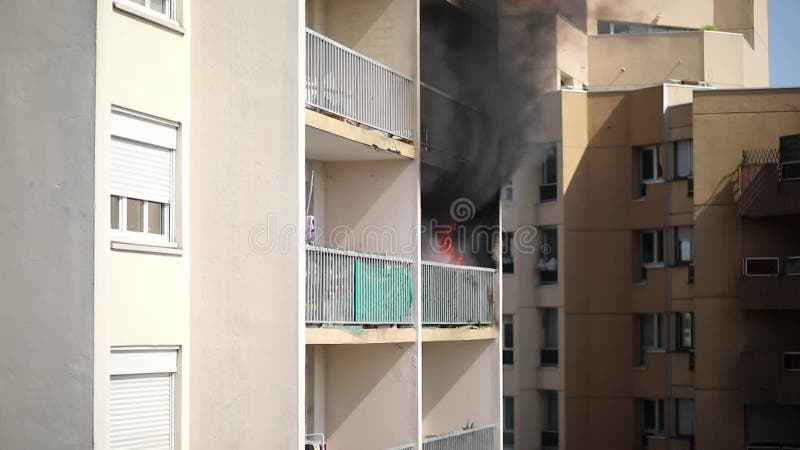 Residential Building on Fire, Flames and Smoke Breaking Out from the ...