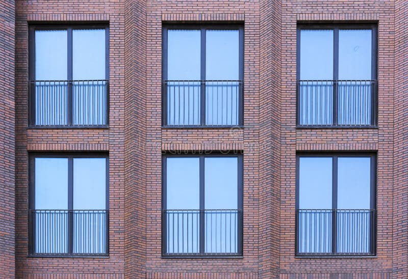 Residential Building in Loft Style. Large Windows in a Red Brick Wall ...