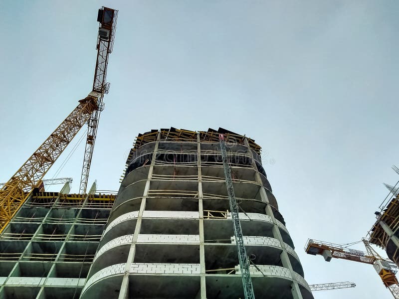Residential Complex Made of Concrete Under Construction with Cranes in ...