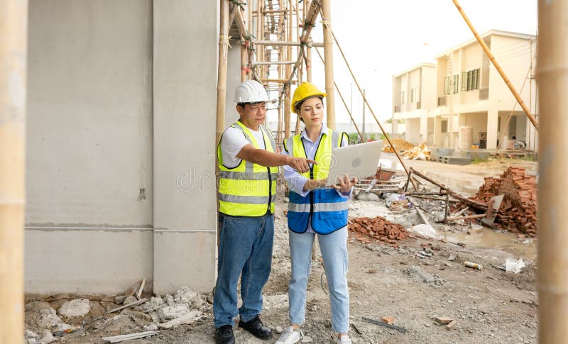Residential Construction Workers Standing at Construction Site Talking ...
