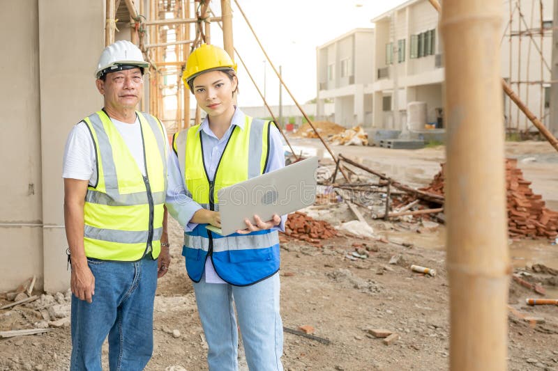 Residential Construction Workers Standing at Construction Site Talking ...