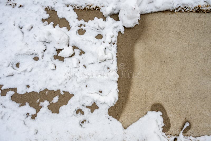 Residential Sidewalk with Section that Has Been Cleared of Snow Next To ...